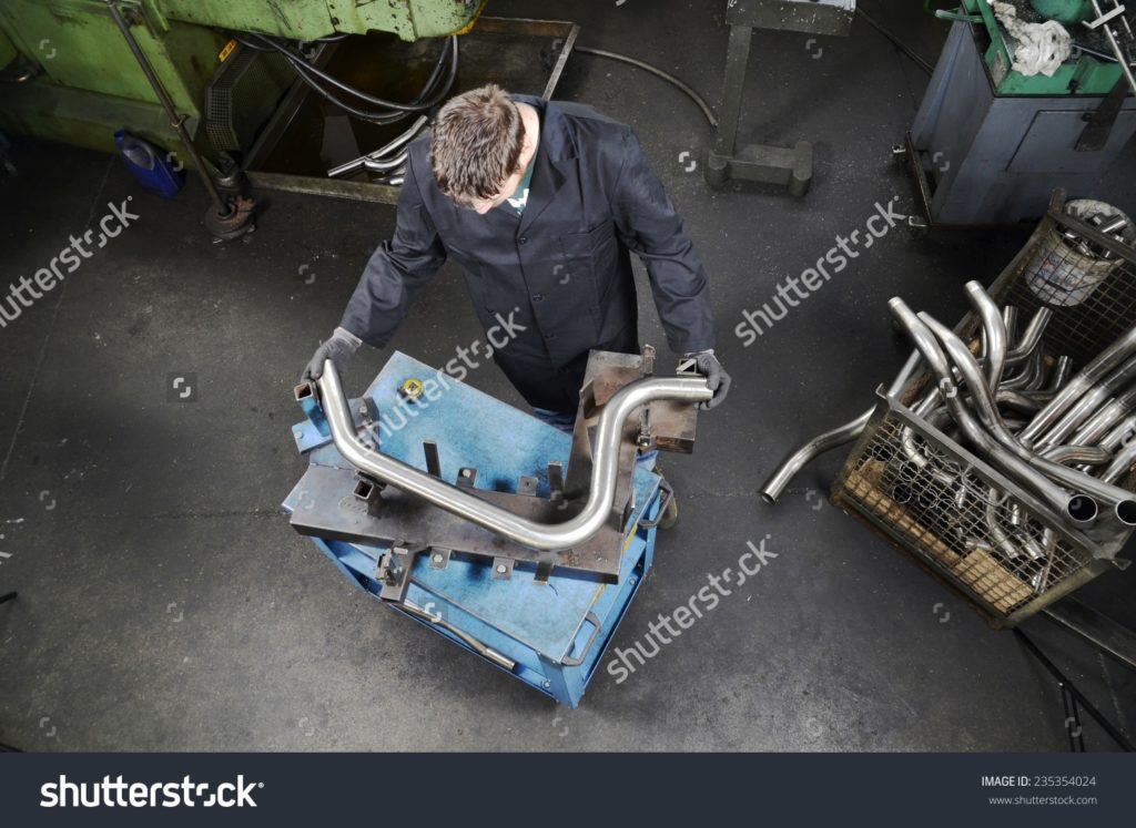 stock-photo-operator-at-work-in-metal-warehouse-checks-and-measures-a ...